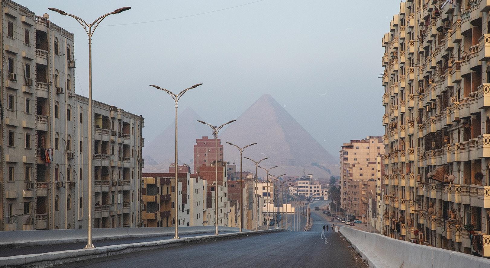 A Different View of the Pyramids: A Modern City Juxtaposed Against ...