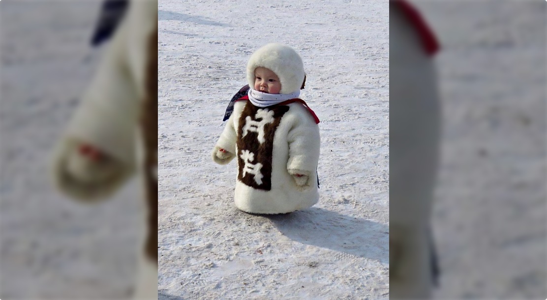 Siberian Yakut Child in Winter Wonderland - Hasan Jasim